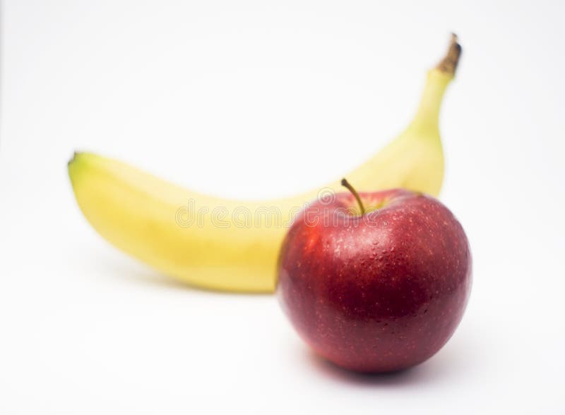 Banana Behind Apple Isolated Stock Photo - Image of snack, green: 127877462