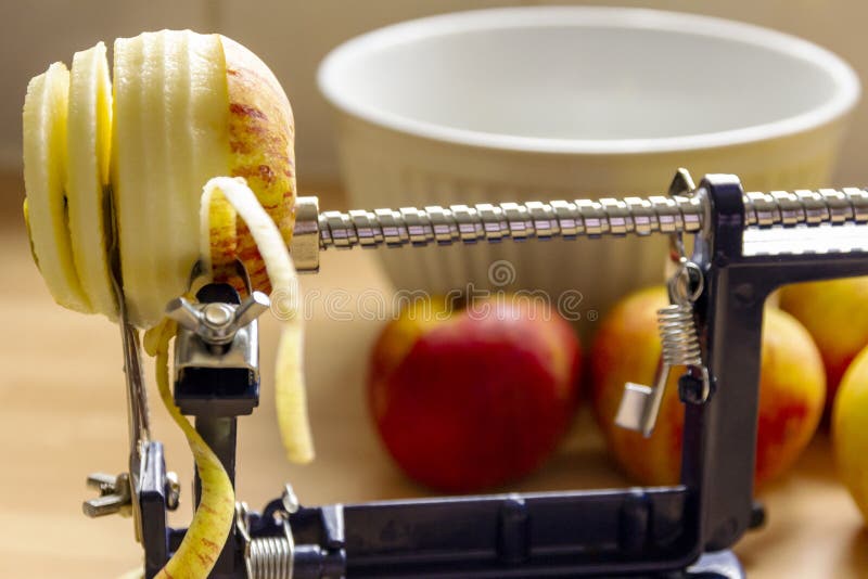 An Apple Being Peeled on an Apple Peeler Stock Photo - Image of food ...
