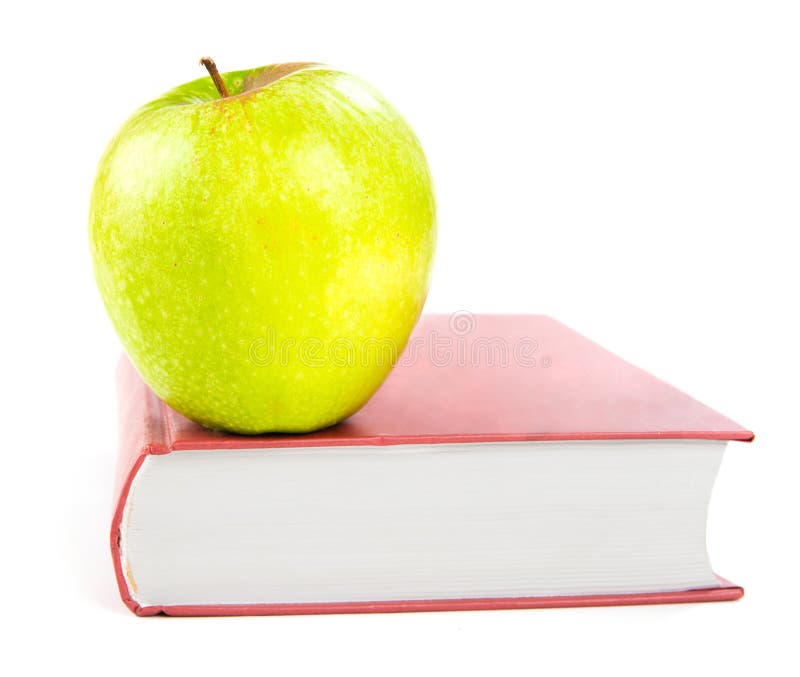 A apple on a book stock image. Image of book, class, school - 19122747