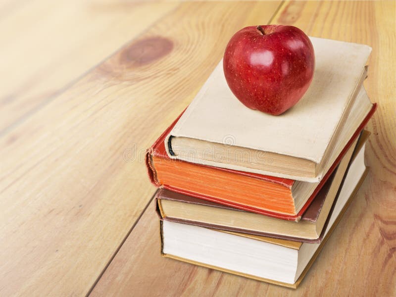 Apple on Books stock photo. Image of studio, stack, side - 59747106