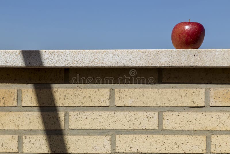 Apple on brick wall stock photo. Image of fruit, promise - 77094492