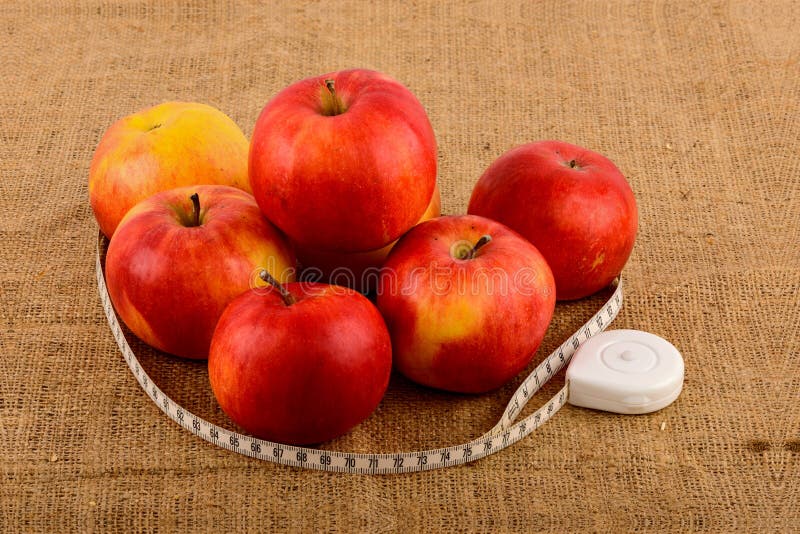 Apple on Burlap with a Centimeter Stock Image - Image of vegetarian ...