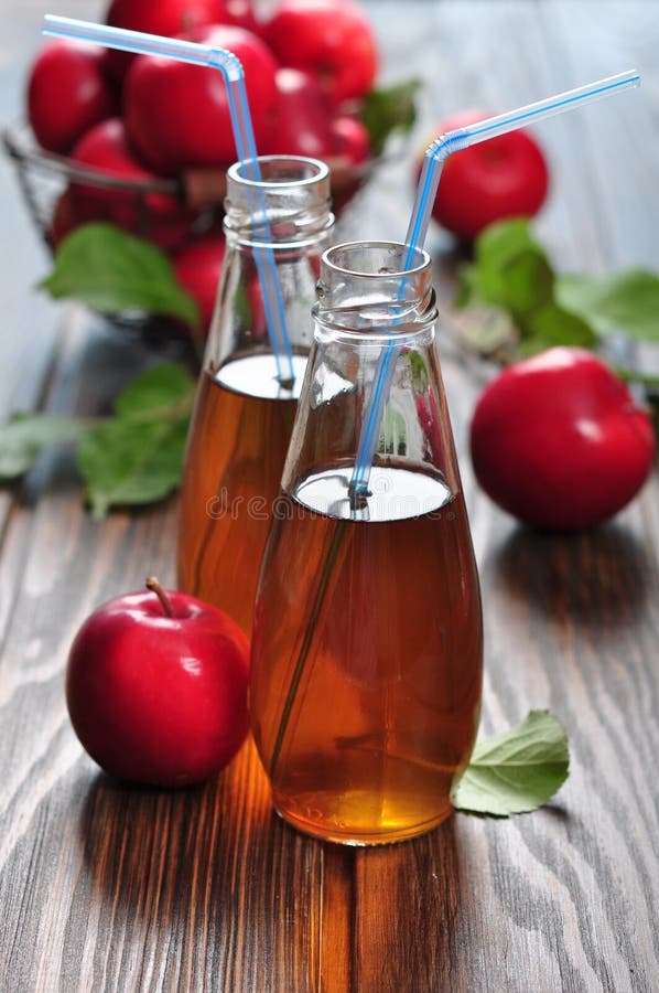 A Bottle of Natural Apple Cider Vinegar on Straw Stock Photo - Image of ...