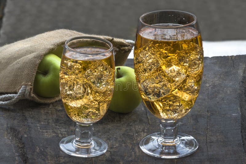 Apple cider with ice cubes stock photo. Image of color - 56204918