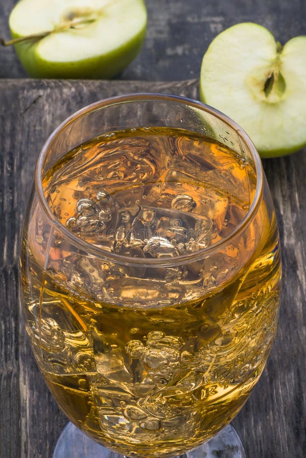 Apple cider with ice cubes stock image. Image of apples - 56204935
