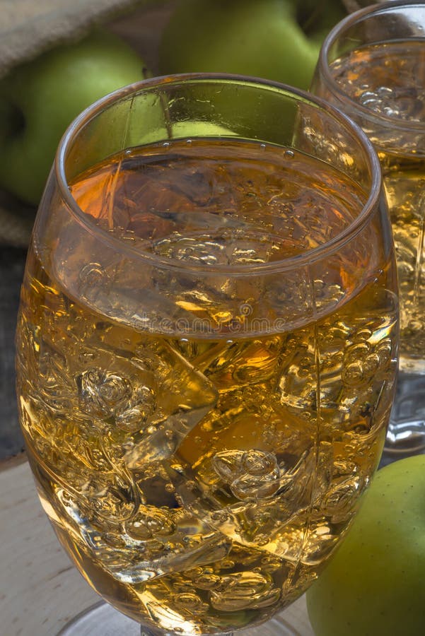 Apple cider with ice cubes stock photo. Image of drink - 56206044