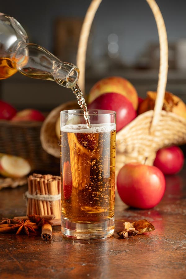 Apple Cider is Poured from a Bottle into a Glass Stock Image - Image of ...