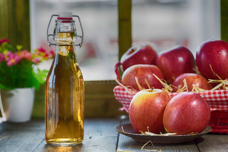 A Bottle of Natural Apple Cider Vinegar on Straw Stock Photo - Image of ...