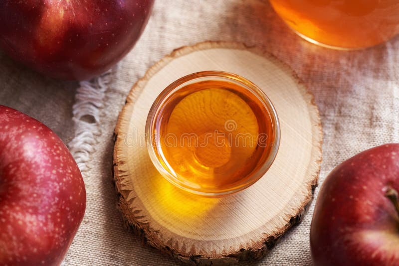 Apple Cider Vinegar in a Glass Bottle with Fresh Apples Stock Image ...