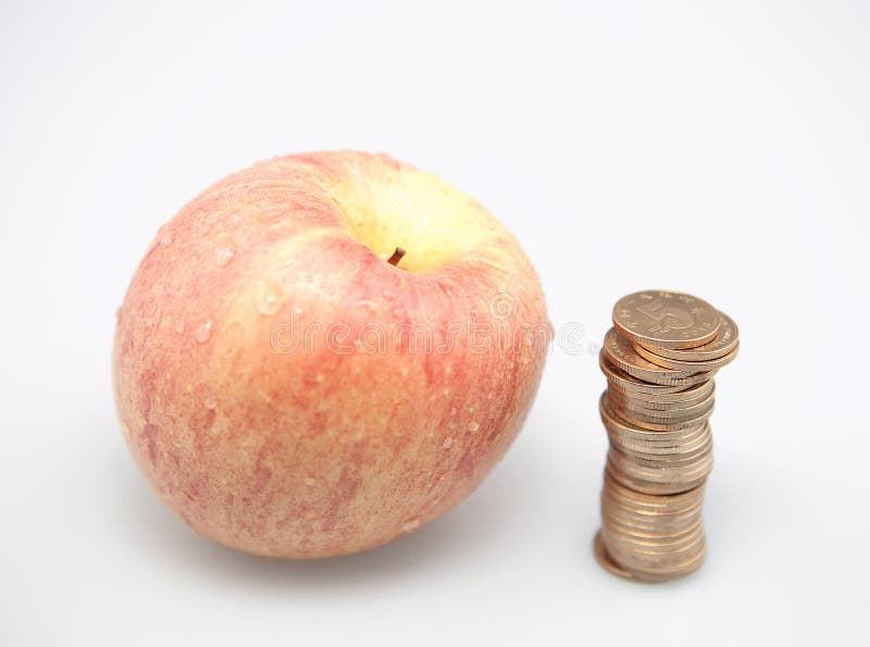 Apple and coins stock photo. Image of coin, business - 70610528