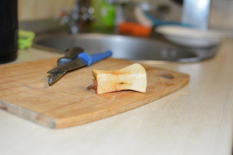 Apple Core on a Cutting Board, on the Kitchen Table Stock Photo - Image ...