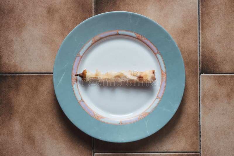 Apple Core in a Dish on the Floor Stock Photo - Image of surrealist ...