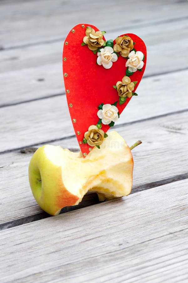 Apple Core and a Red Carton Heart Stock Image - Image of wood, surface ...