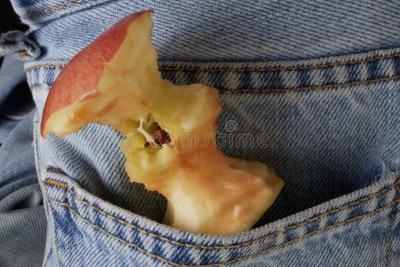 Apple Core Sticking Out from Pants Pocket Stock Image - Image of core ...