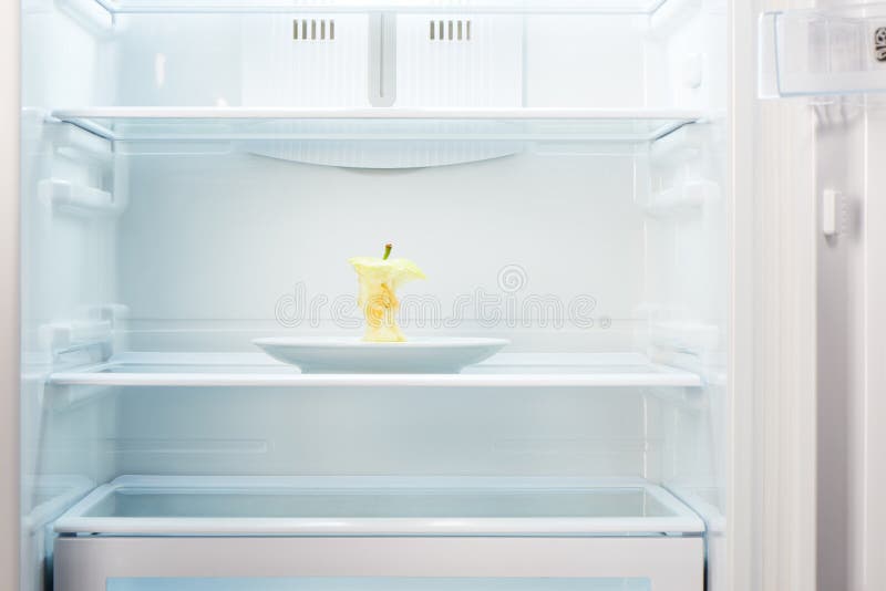 Apple Core on White Plate in Open Empty Refrigerator Stock Image ...