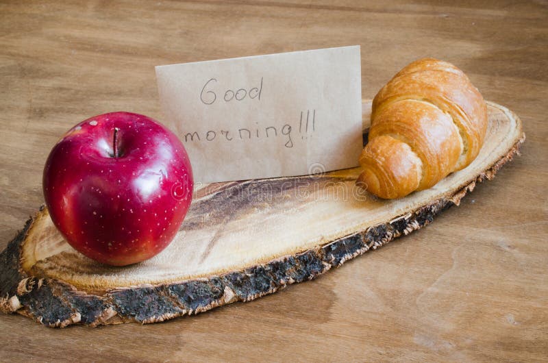Apple, Croissant and Good Morning Note on Rustic Wooden Background ...