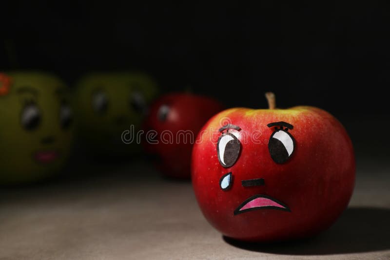 Apple with Crying Face on Grey Table. Concept of Jealousy Stock Image ...