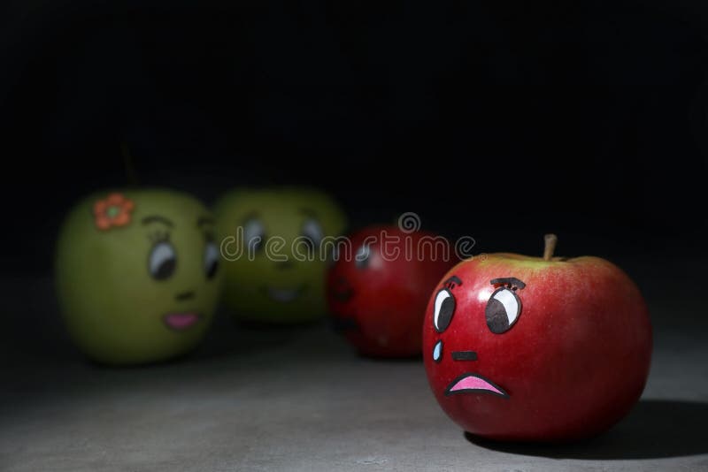 Apple with Crying Face on Grey Table. Concept of Jealousy Stock Image ...