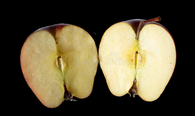 Apple Cut in Half Isolated on Black Background Stock Image - Image of ...