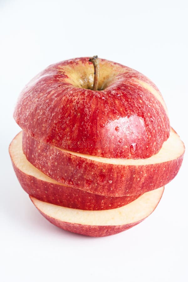 Apple Cut into Pieces on a White Background. Stock Photo - Image of ...