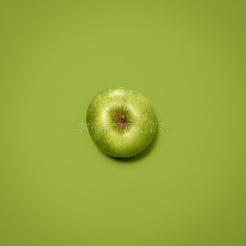 An Apple a Day. Shot of a Green Apple Against an Empty Studio ...