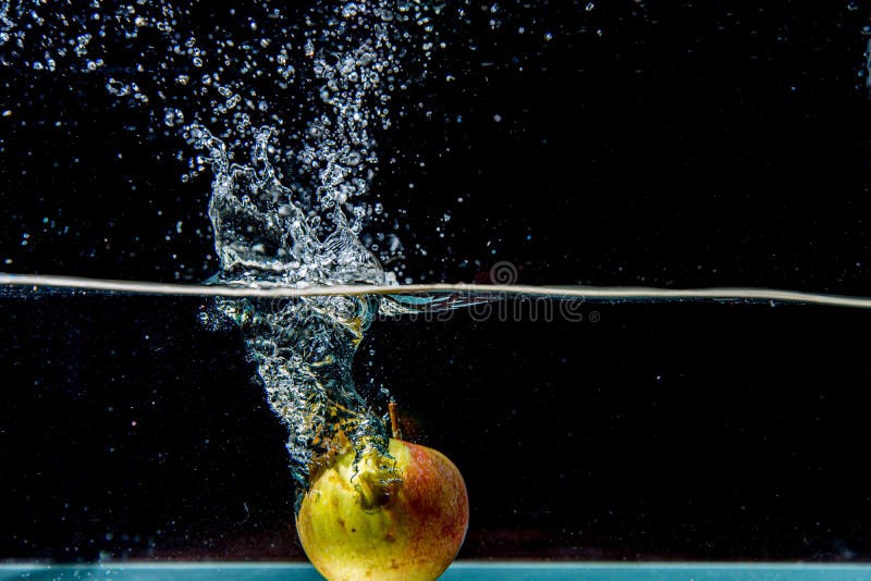 Apple Falling in Dark Water with Splashes Stock Photo - Image of nature ...