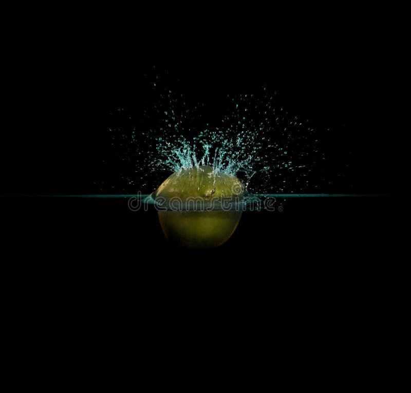 Apple Falling Down into Clear Water Against Black Background Stock ...