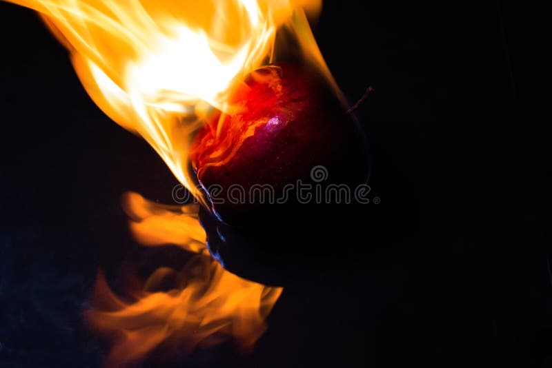Apple hit the fire tribe. stock image. Image of fire - 118428753