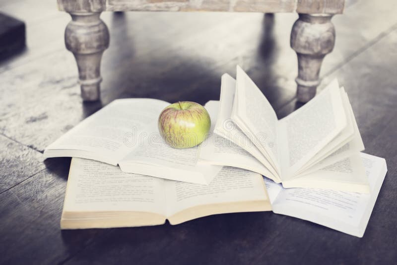 Apple and Four Open Books on a Floor Stock Photo - Image of information ...