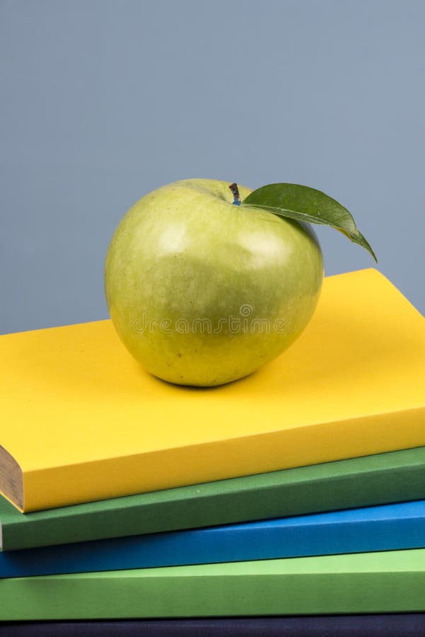 Apple Fruit on Top of a Book Stack, on the Back of School Classes ...