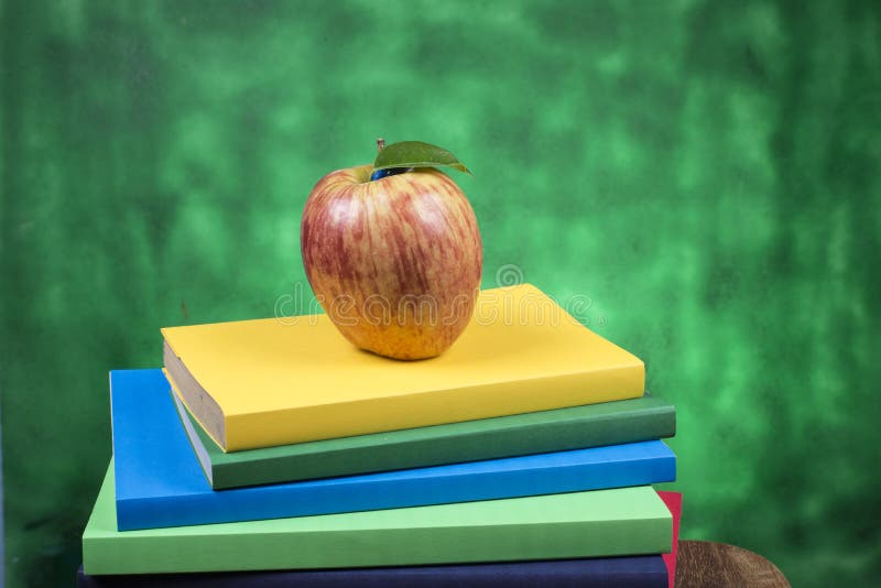 Apple Fruit on Top of a Book Stack, on the Back of School Classes Stock ...