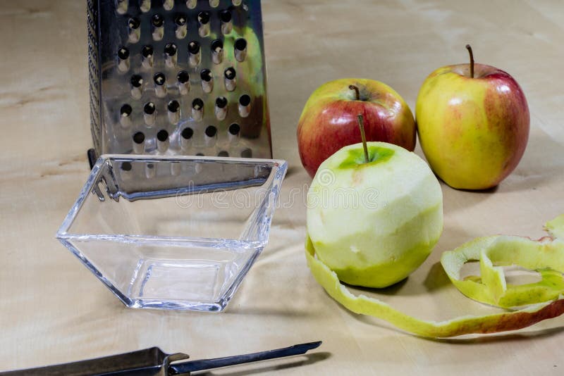The Apple Grated on a Kitchen Grater. Kitchen Countertop and ...