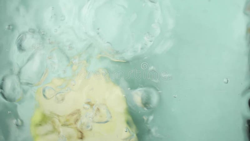 Apple Half Drops into Water from Above Creating a Splash. As the Apple ...