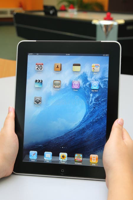 Apple iPad on hand editorial stock photo. Image of hand - 17074443