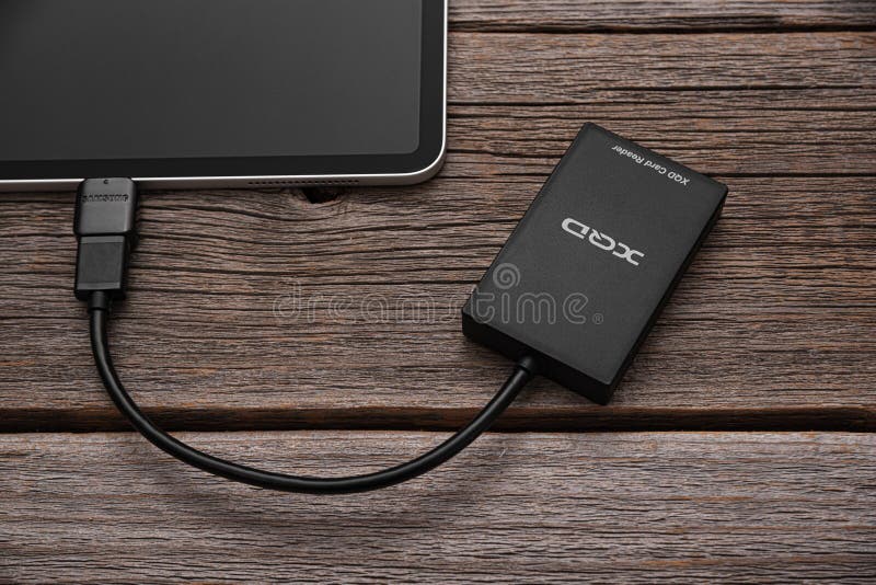 A Apple Ipad Pro with an XQD Memory Card Connected Via OTG Via a Card ...