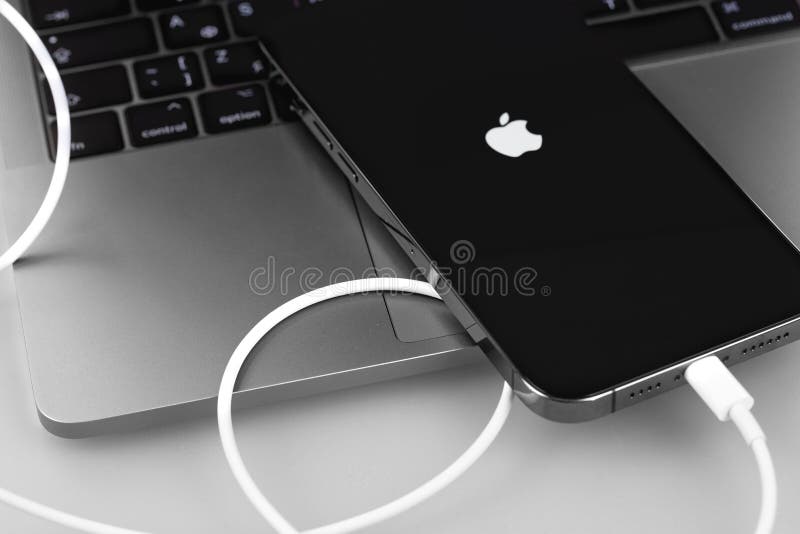Apple IPhone Smartphone Connected To MacBook with Lightning Cable ...