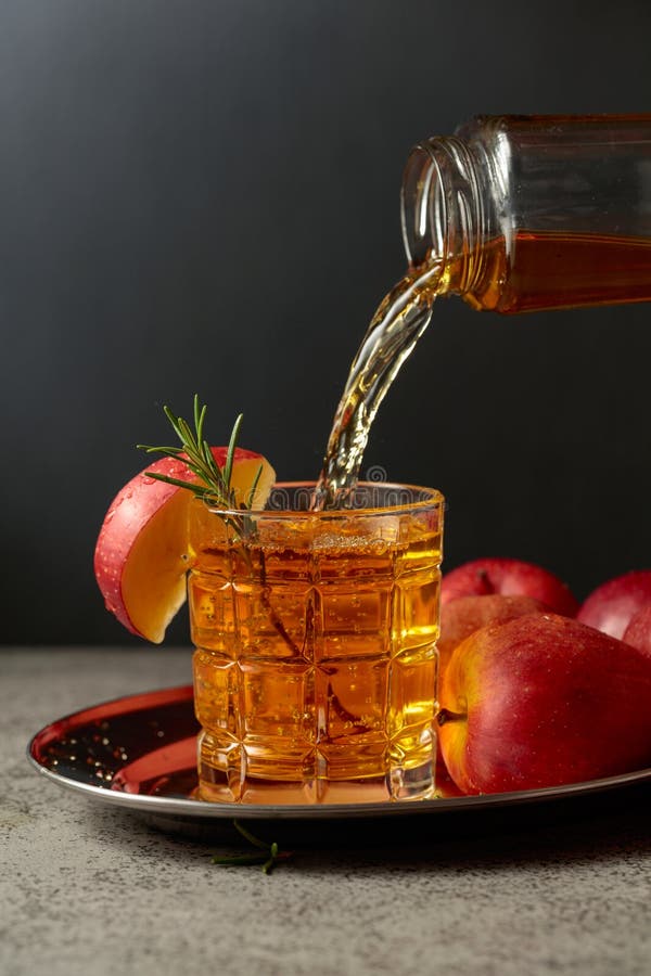 Apple Juice is Poured from a Bottle into a Glass Stock Photo - Image of ...
