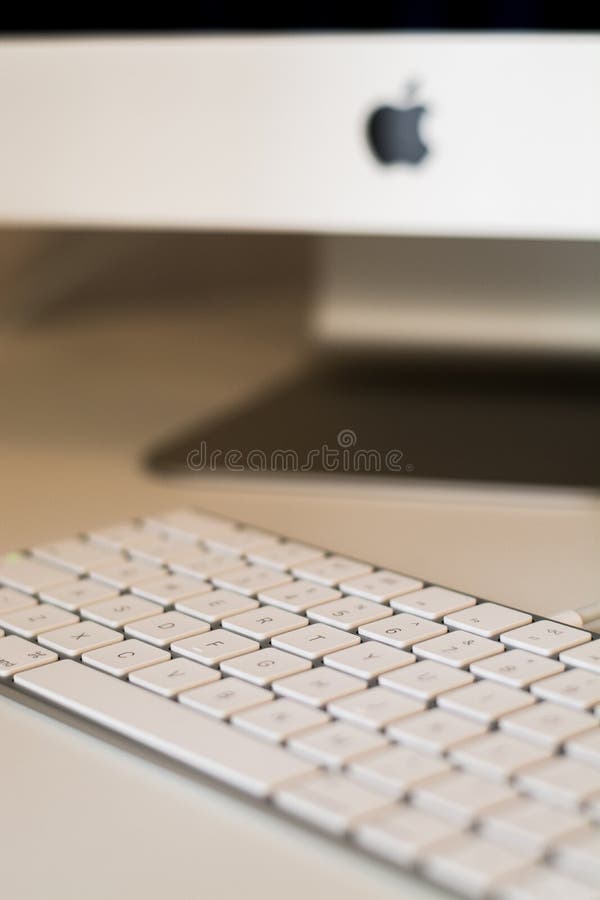 Apple Keyboard with Blurred Monitor in the Background Editorial ...