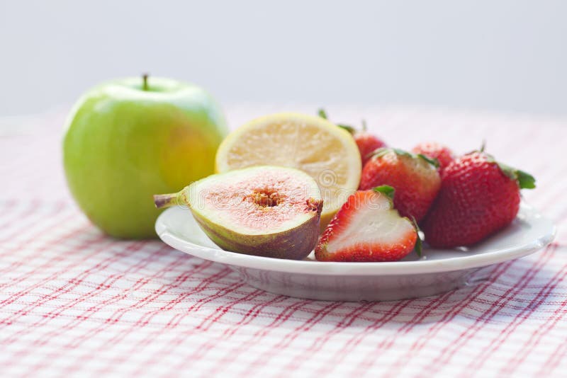 Apple, Lemon, Fig and Strawberries Stock Image - Image of leaf, food ...