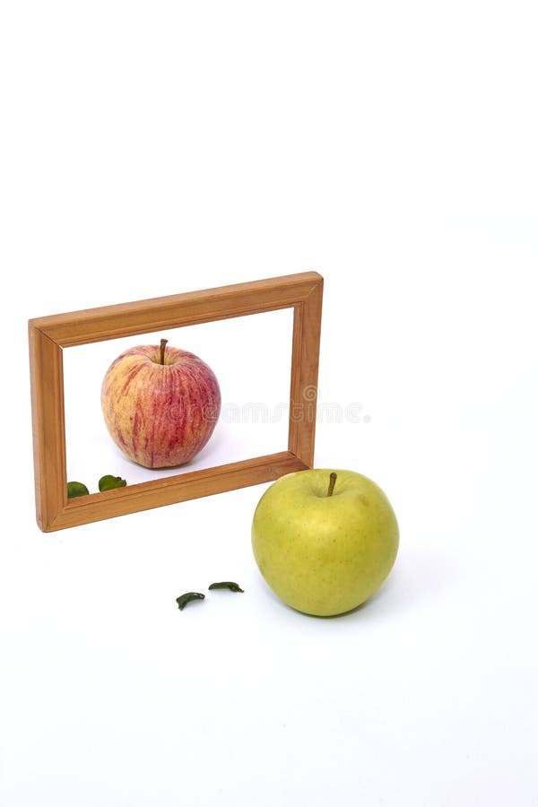 Apple looking in mirror stock photo. Image of imitation - 165576556