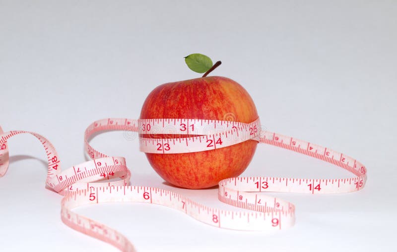 Apple and measuring tape stock image. Image of measure - 809397