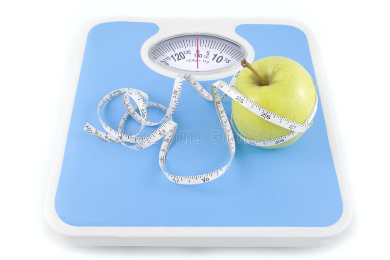 An Apple with a Measuring Tape and Scale Stock Photo - Image of ...