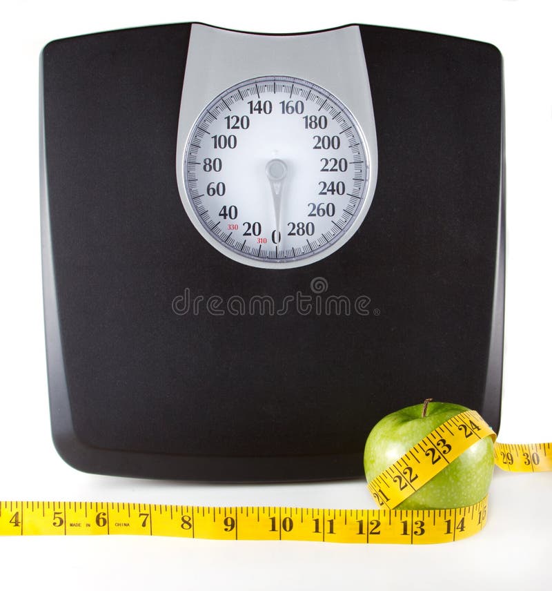 An Apple with a Measuring Tape and Scale Stock Photo - Image of ...