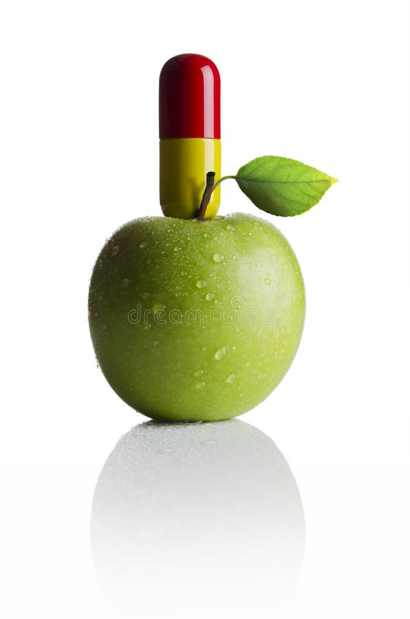 Apple with a medicine pill stock image. Image of pharmaceutical - 34910891