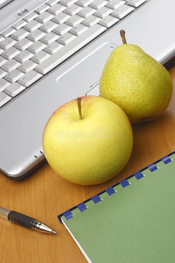 Apple,pear,pen and laptop stock image. Image of organic - 11820361
