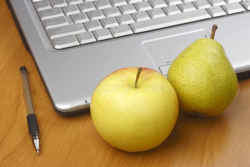 Apple,pear,pen and laptop stock image. Image of vegetarian - 11820385