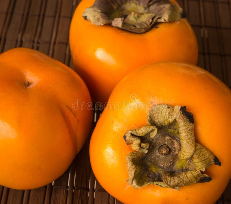 Apple persimmon stock image. Image of pretty, orange - 56720189
