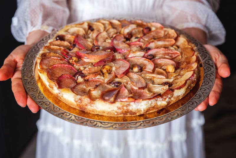 Apple Pie in the hands stock image. Image of chocolate - 101898417