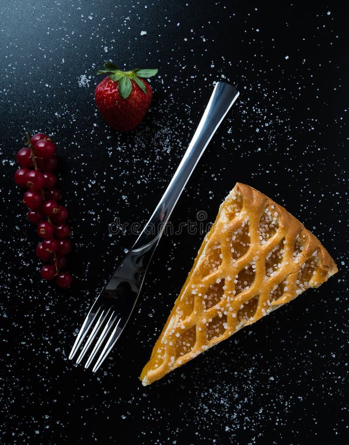 Apple Pie Slice on Black Table with Currant and Strawberry Stock Photo ...