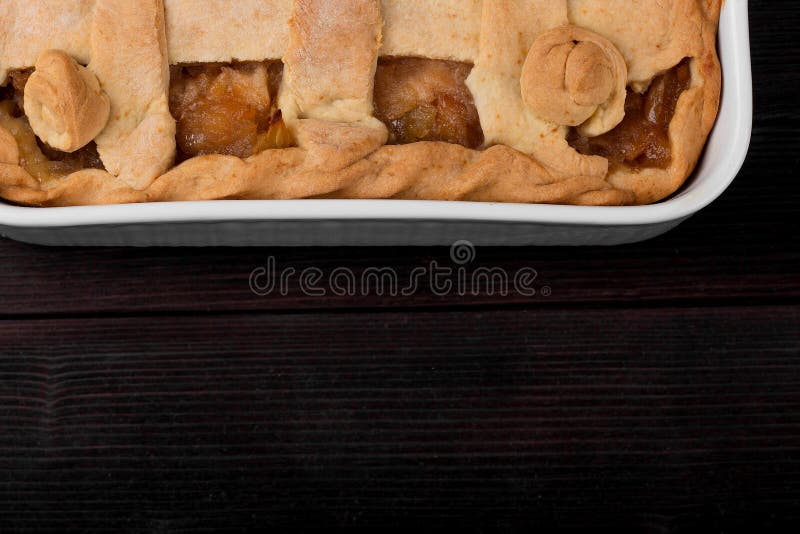 Apple Pie in a Square Ceramic Baking Sheet on a Dark Wooden Background ...